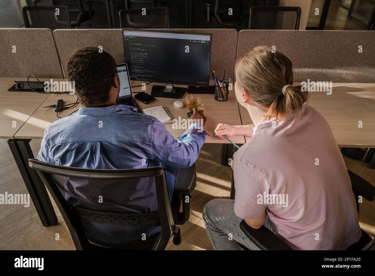 Team of professional software developer and brainstorming and programming on site, software and ...