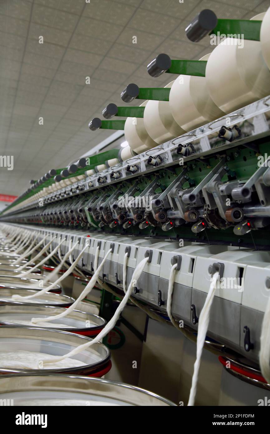 Cotton group in spinning production line factory Stock Photo - Alamy