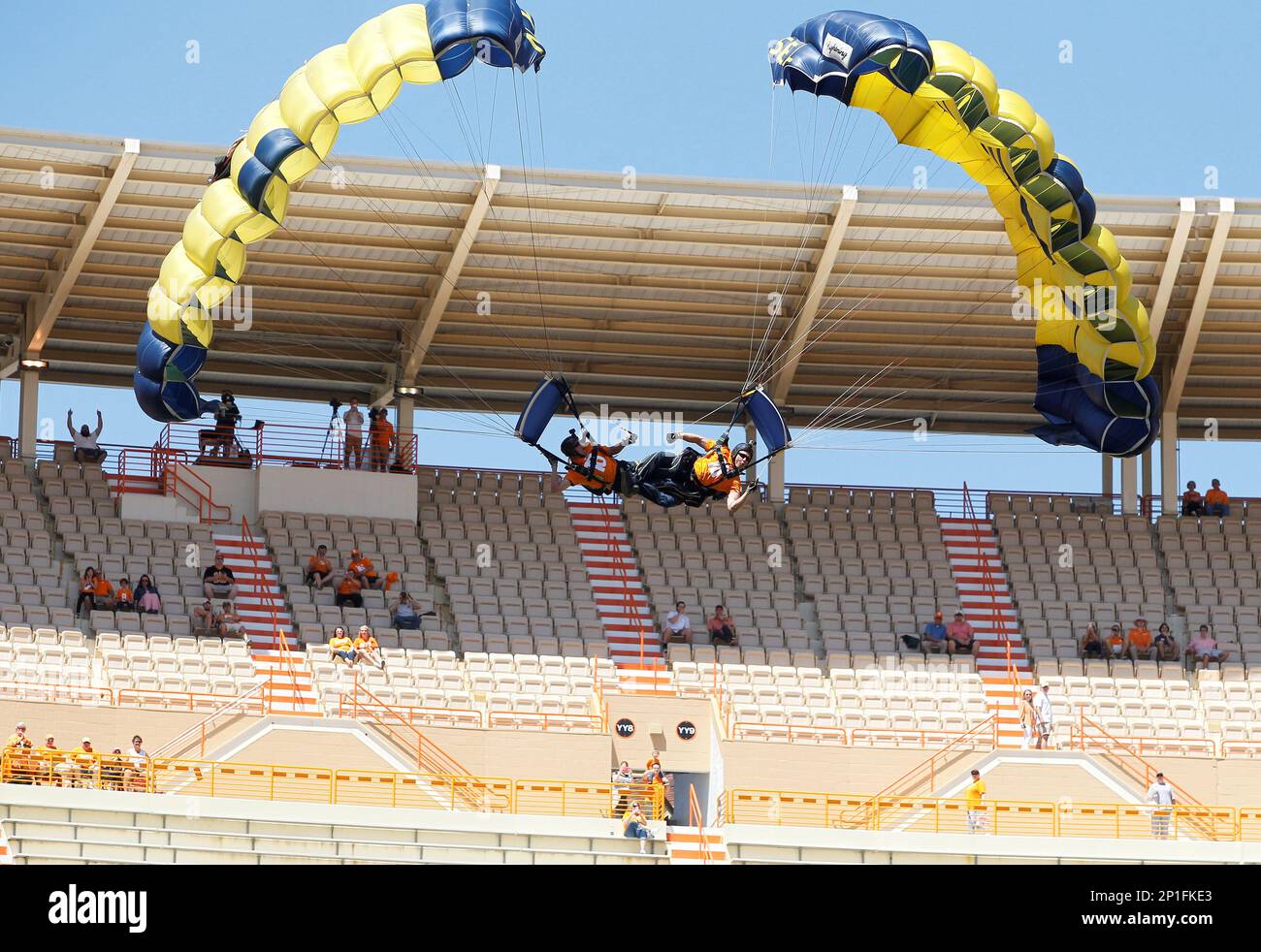 April 16, 2016: Members of the Navy SEAL parachute team perform prior ...