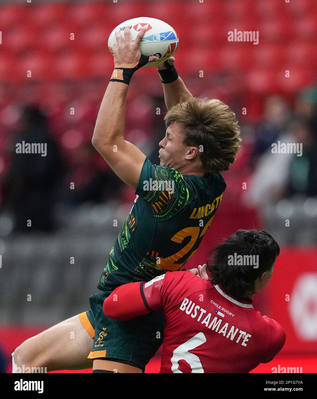 Australia's Darby Lancaster, top, grabs the ball out of the air above ...