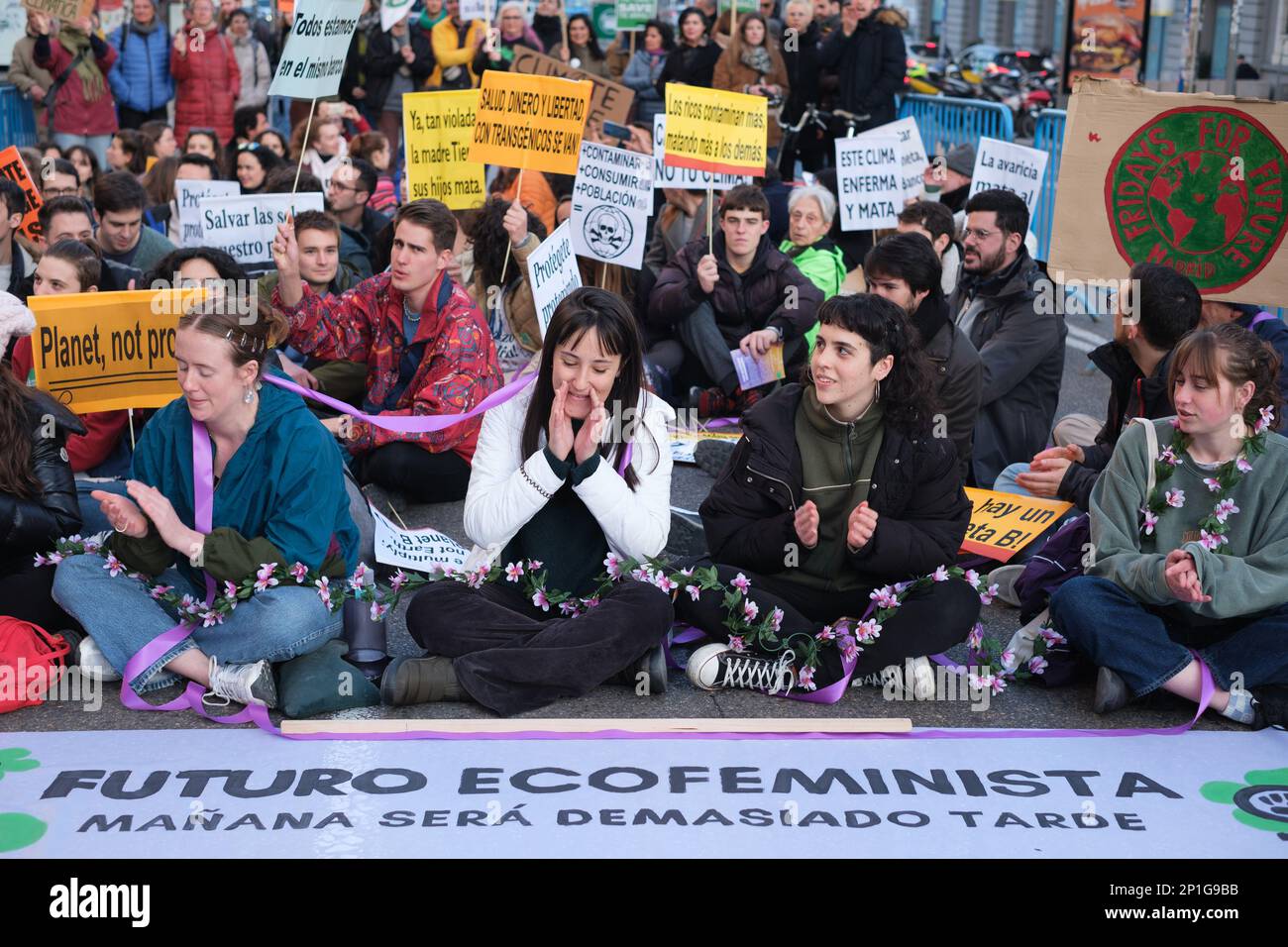 Protesters hold placards expressing their opinion during a ...