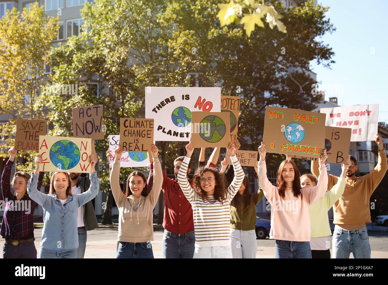 Group of people with posters protesting against climate change on city ...