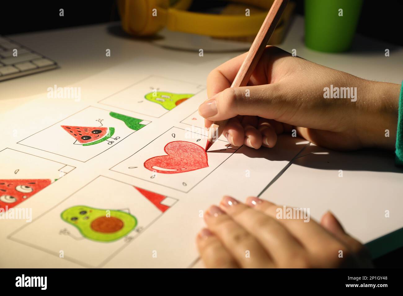 Woman drawing cartoon sketch at workplace, closeup. Pre-production ...