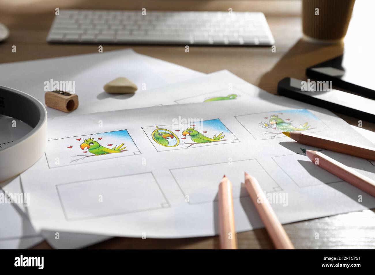 Storyboards with cartoon sketches at workplace, closeup. Pre-production ...