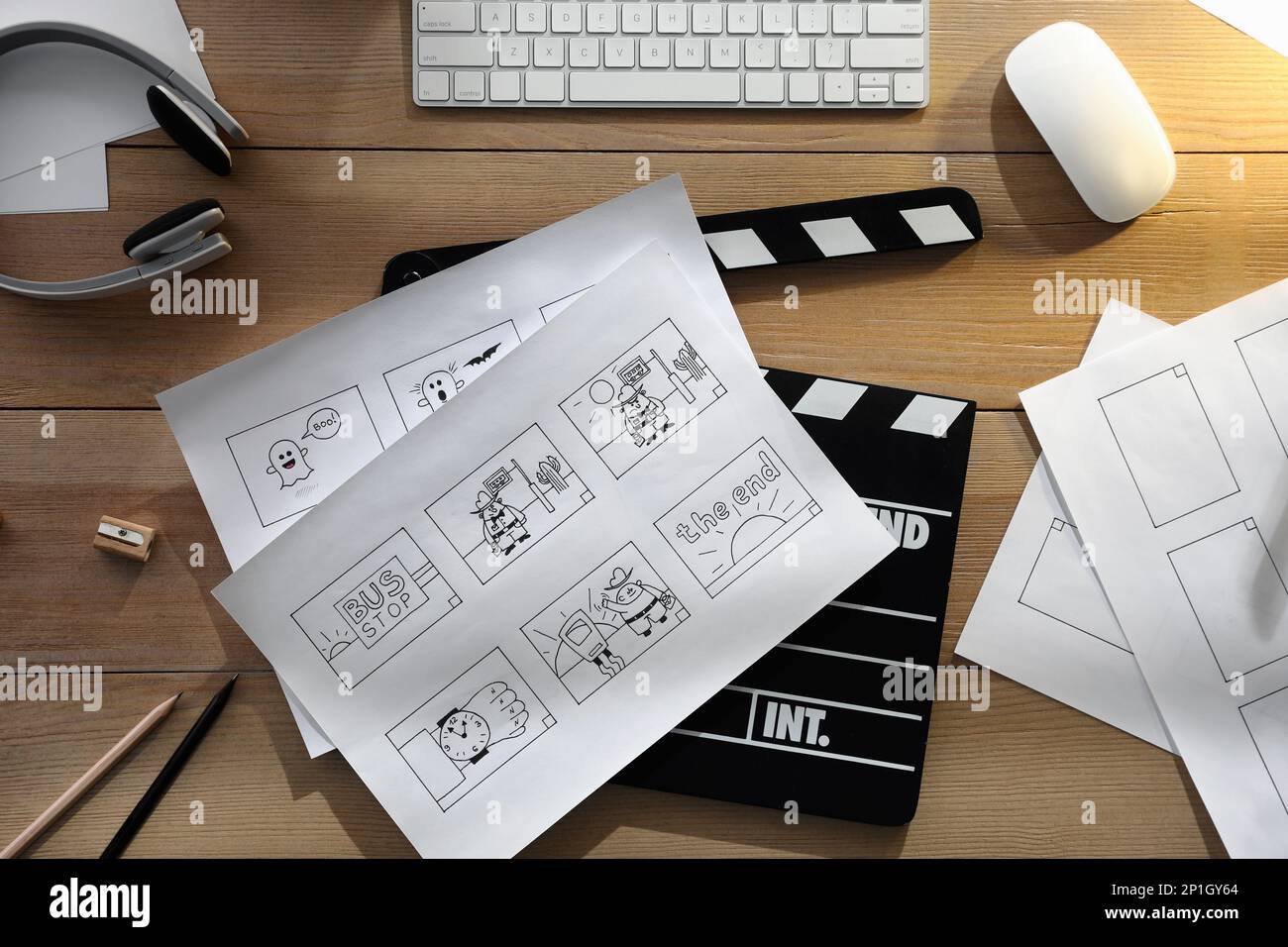 Storyboards with cartoon sketches at workplace, flat lay. Pre ...