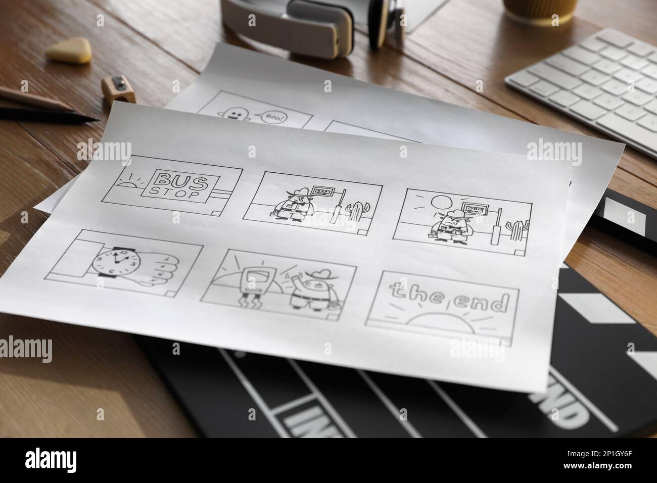 Storyboards with cartoon sketches at workplace, closeup. Pre-production ...