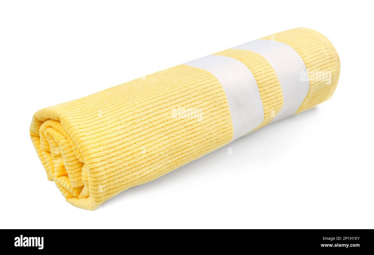 Rolled yellow beach towel on light grey background Stock Photo - Alamy