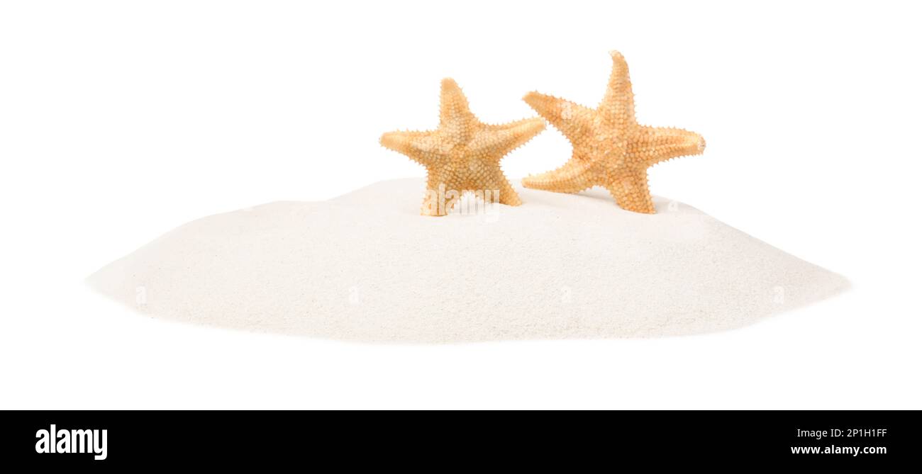 Beautiful sea stars in sand on white background Stock Photo - Alamy