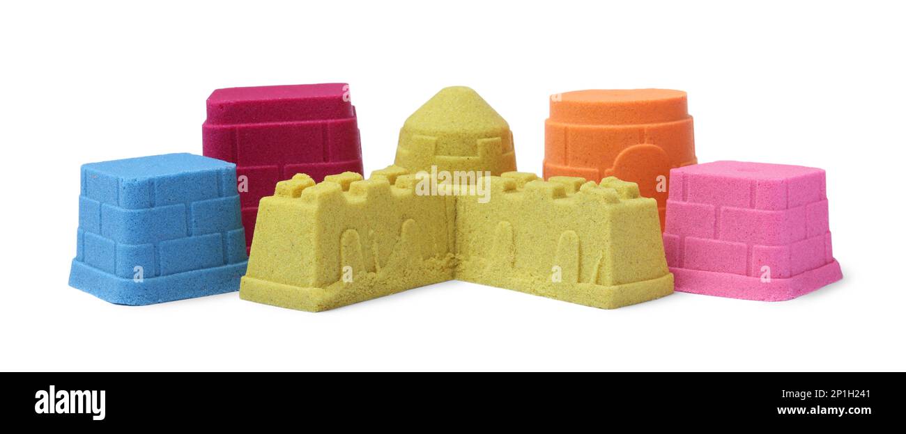 Different towers made of kinetic sand on white background Stock Photo ...