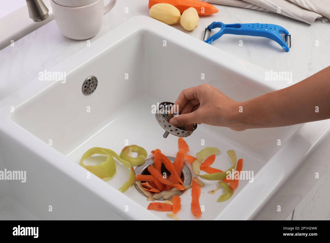 Woman putting trash garbage hi-res stock photography and images - Alamy