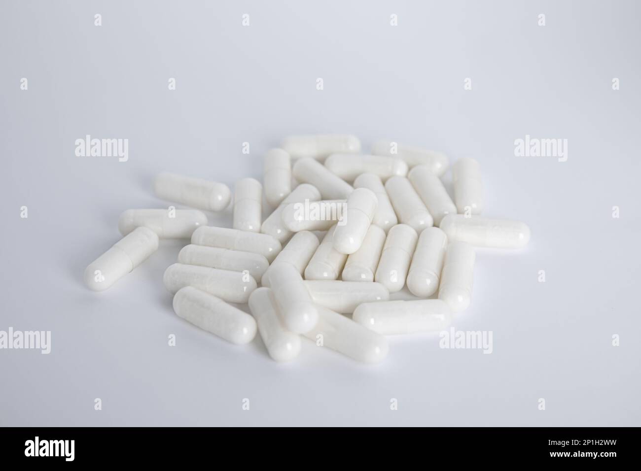 Pile of amino acid pills on white background Stock Photo - Alamy