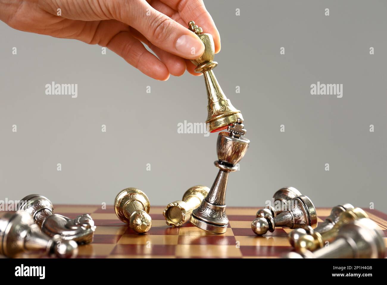 Woman moving piece on chessboard hi-res stock photography and images ...