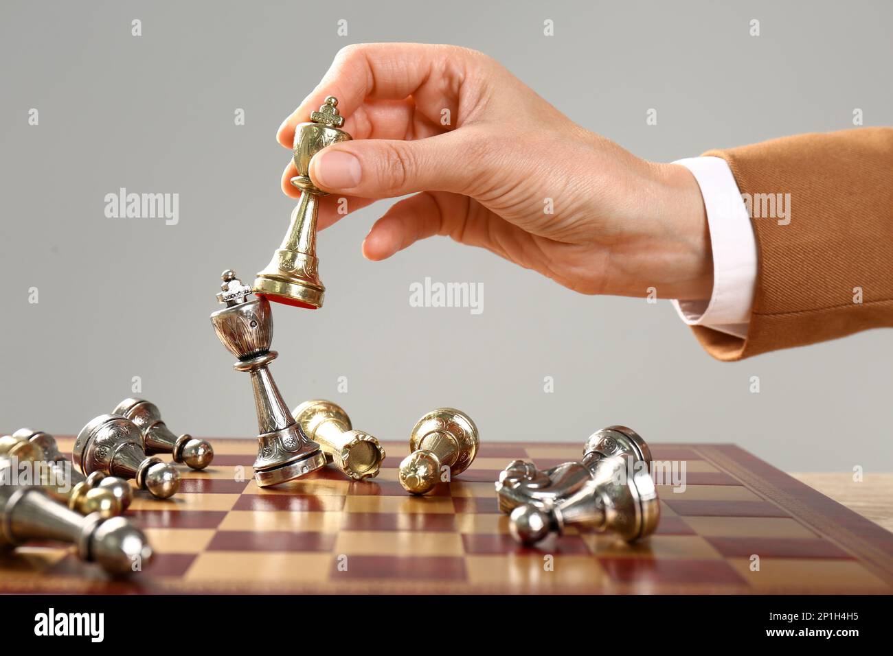 Woman moving chess piece hi-res stock photography and images - Alamy