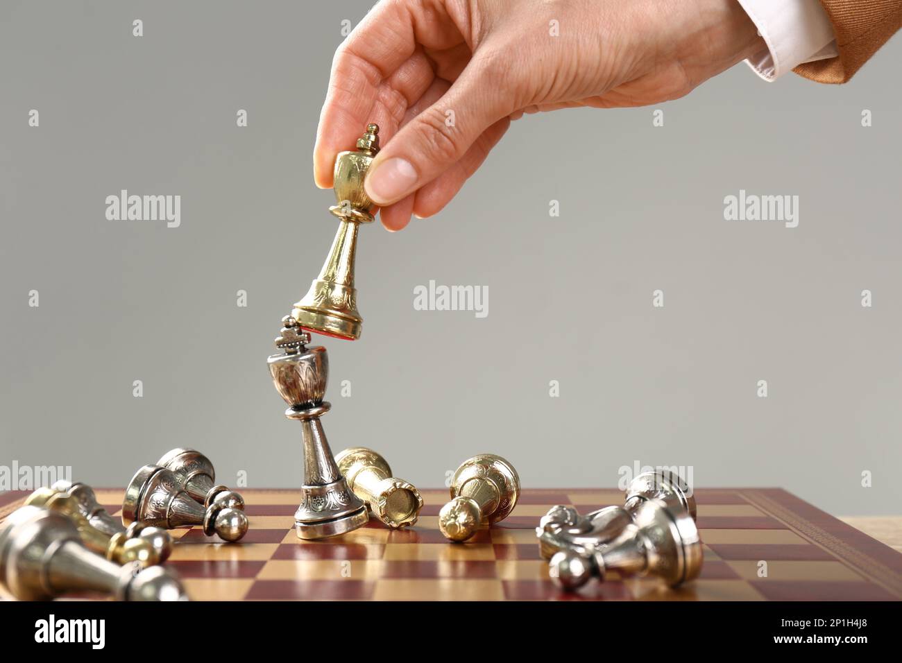 Woman moving piece on chessboard hi-res stock photography and images ...