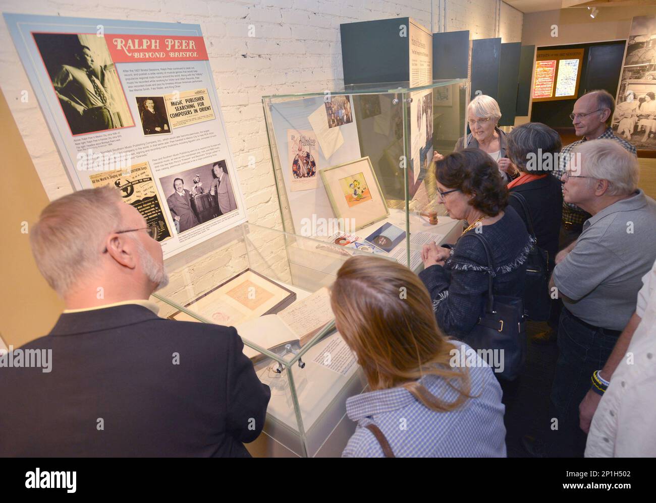 Liz Peer, top left, talks to visitors to the special display, including ...