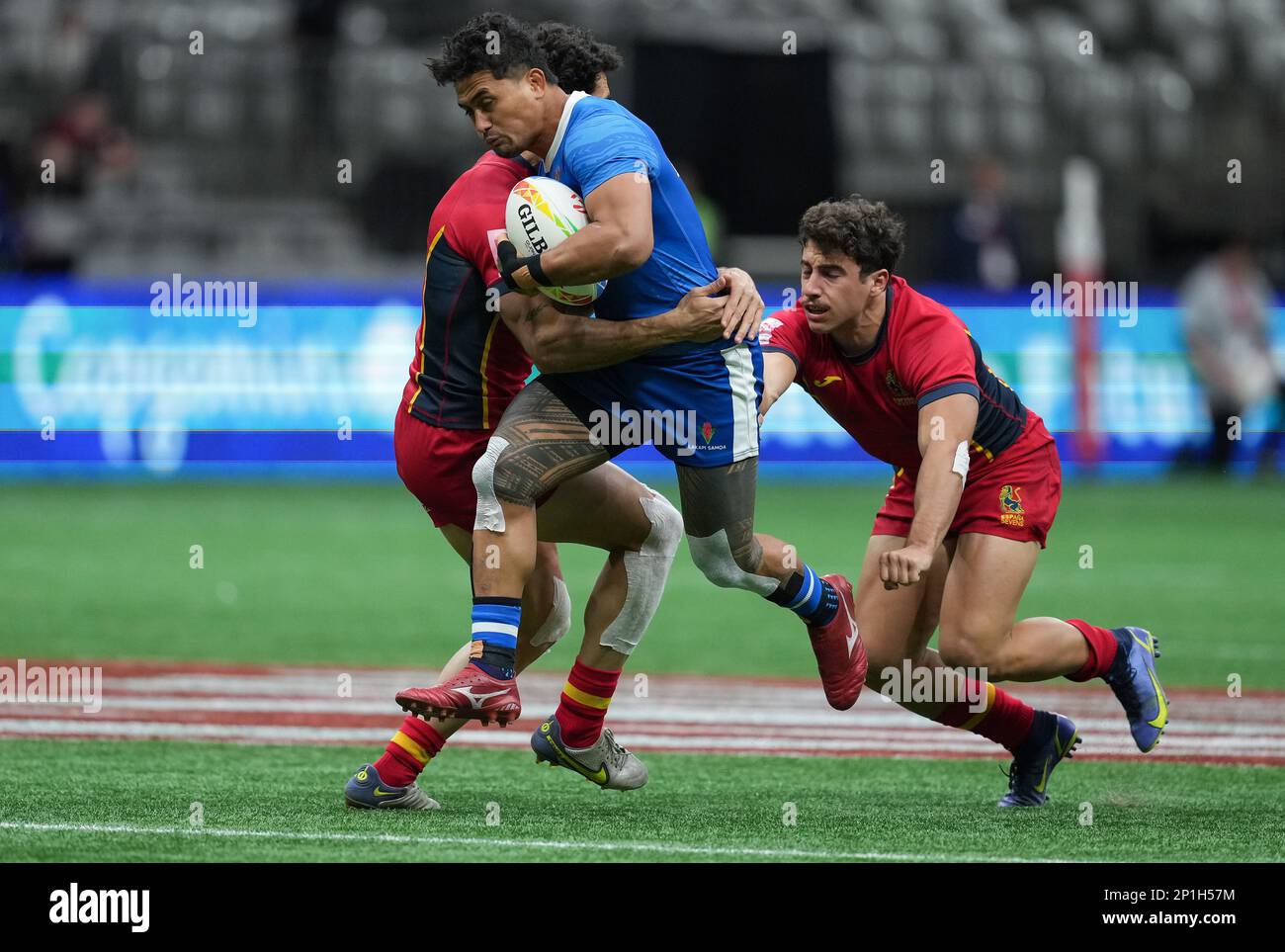 Samoa's Melani Matavao, front centre, runs the ball for a try past ...