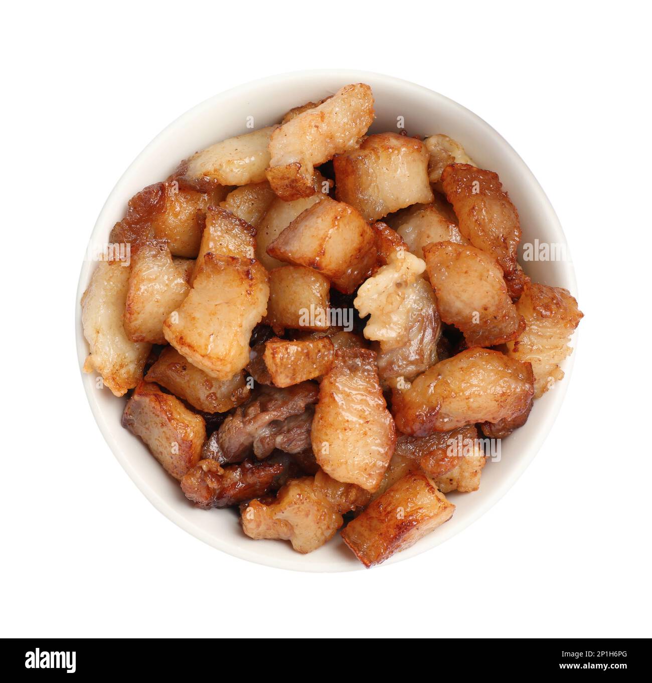 Tasty fried cracklings in bowl on white background, top view. Cooked ...