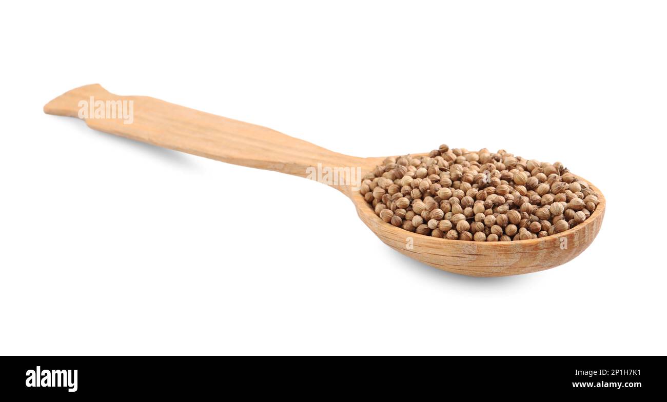 Dried coriander seeds with wooden spoon isolated on white Stock Photo - Alamy