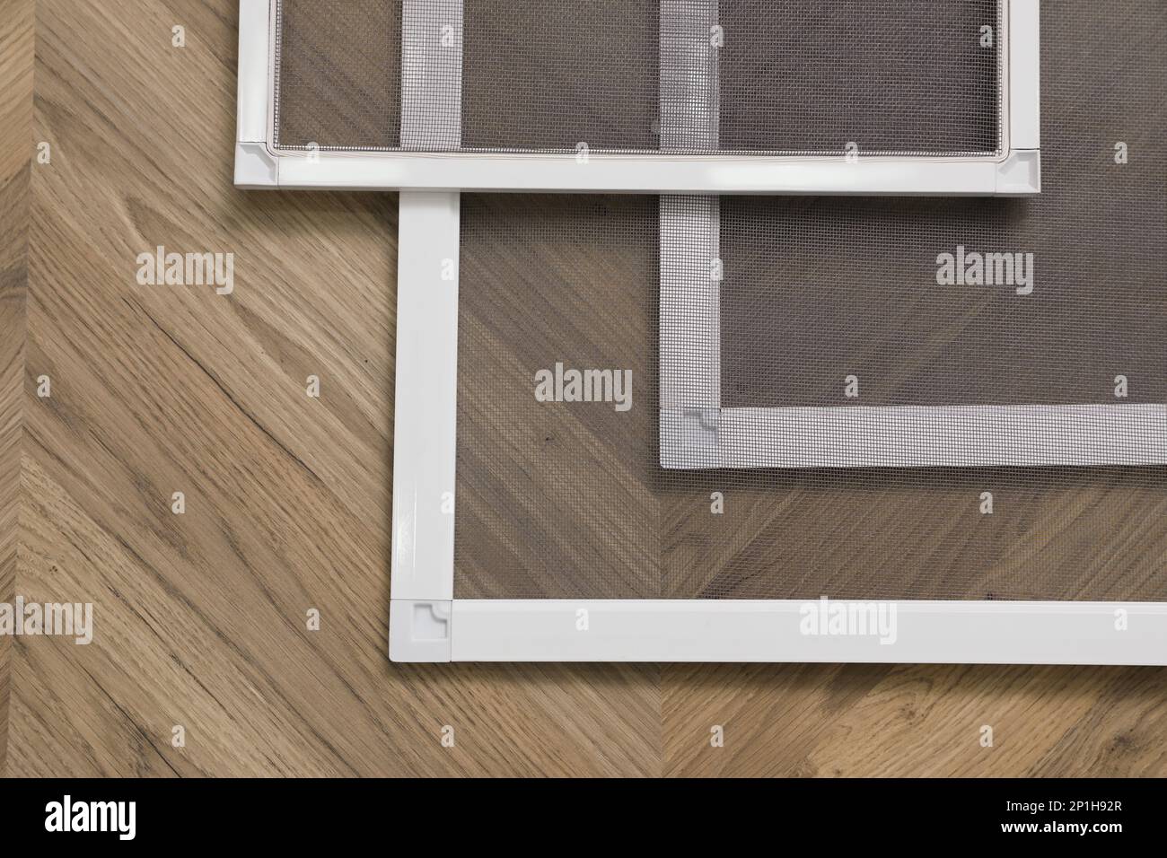 Set of window screens on wooden floor, flat lay Stock Photo - Alamy