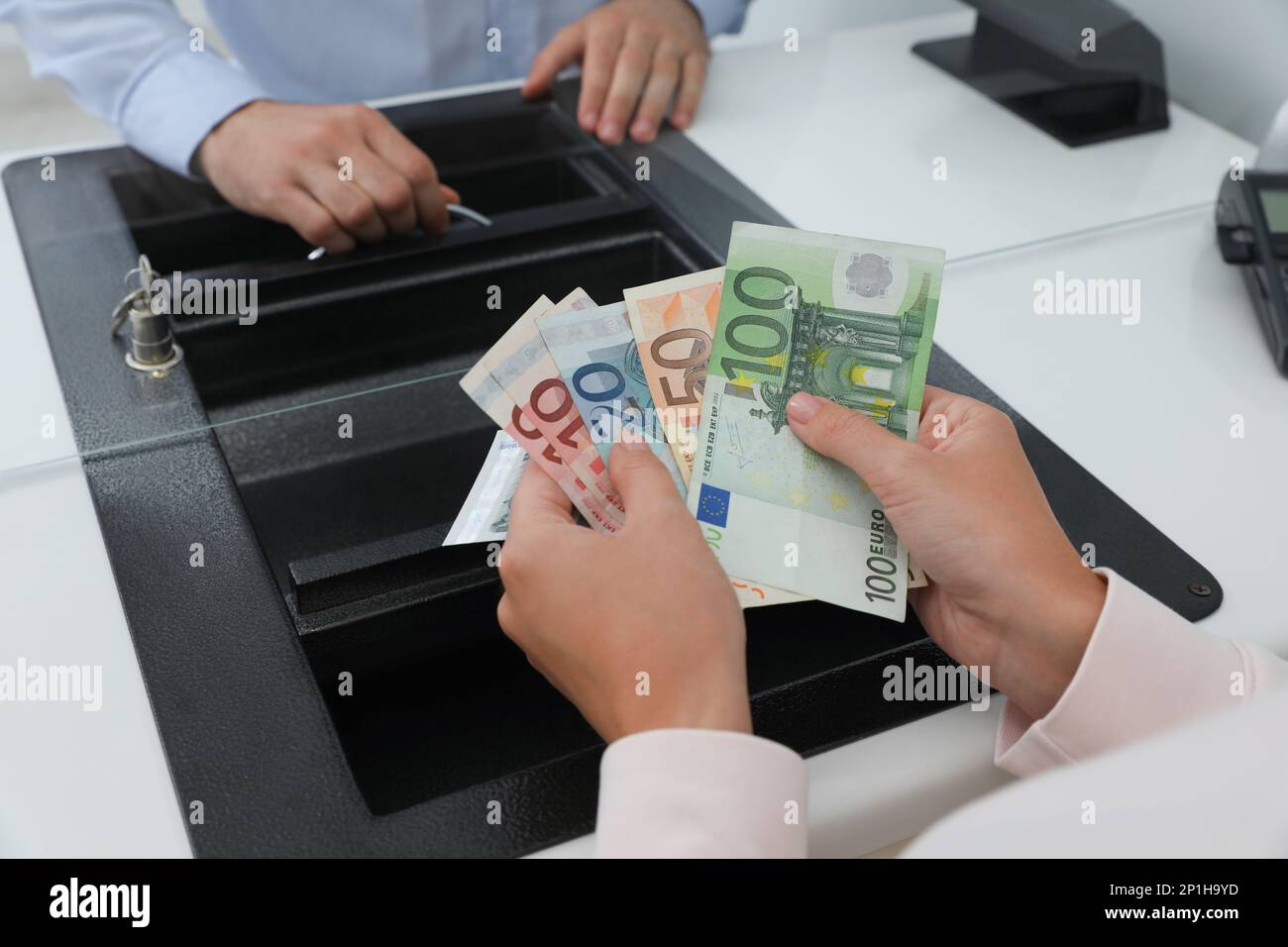 Bank banking woman female teller window hi-res stock photography and ...