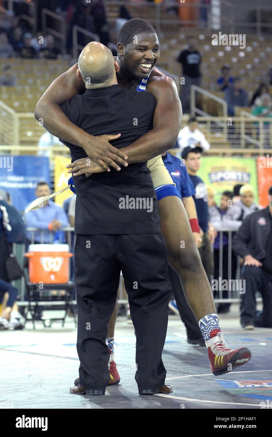 Miami South Dade's Kyron Taylor, right, celebrates after defeating ...
