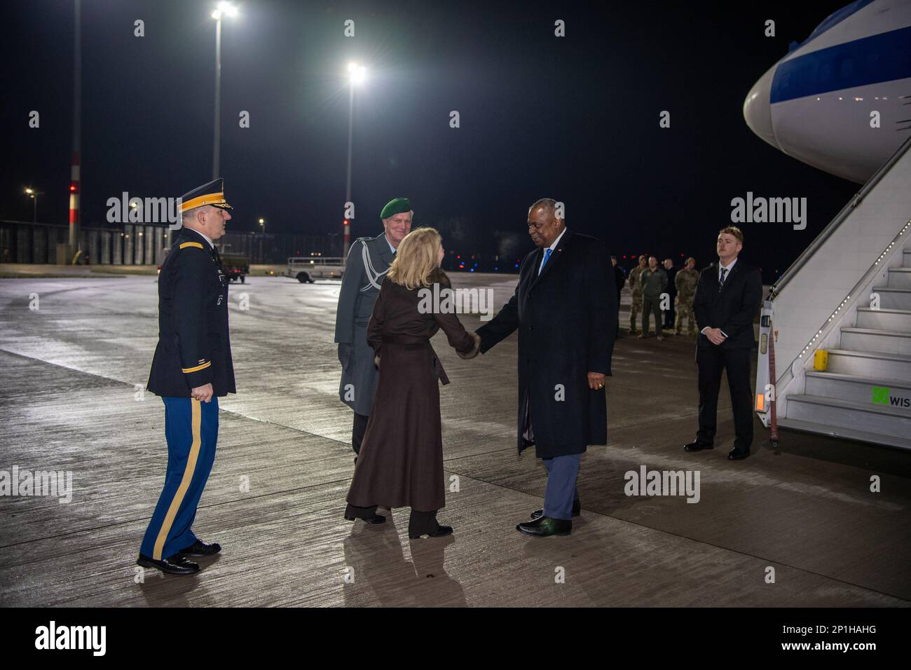 Secretary of Defense Lloyd J. Austin III is greeted by Ambassador Amy ...