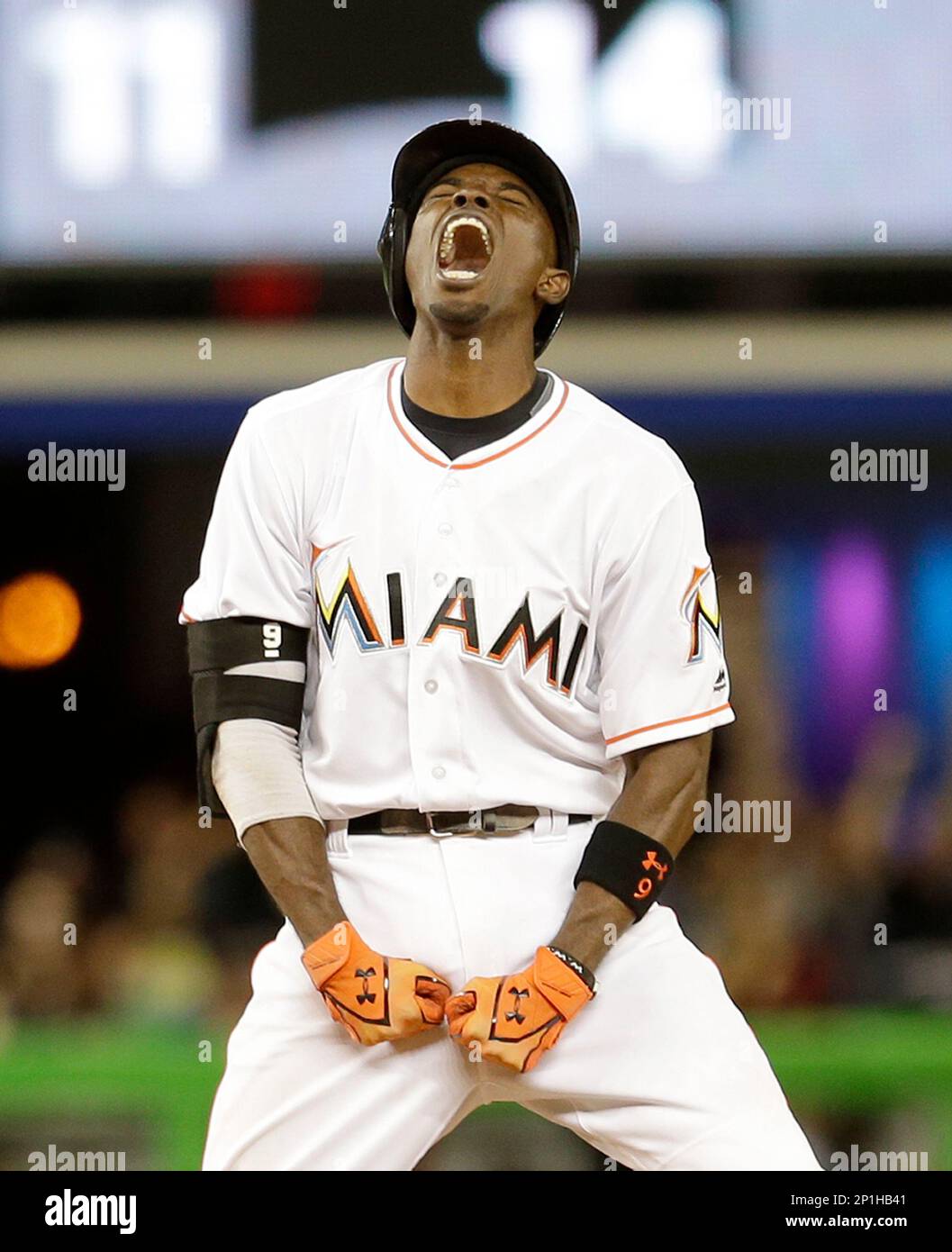 Miami Marlins' Dee Gordon celebrates after hitting a double against the ...
