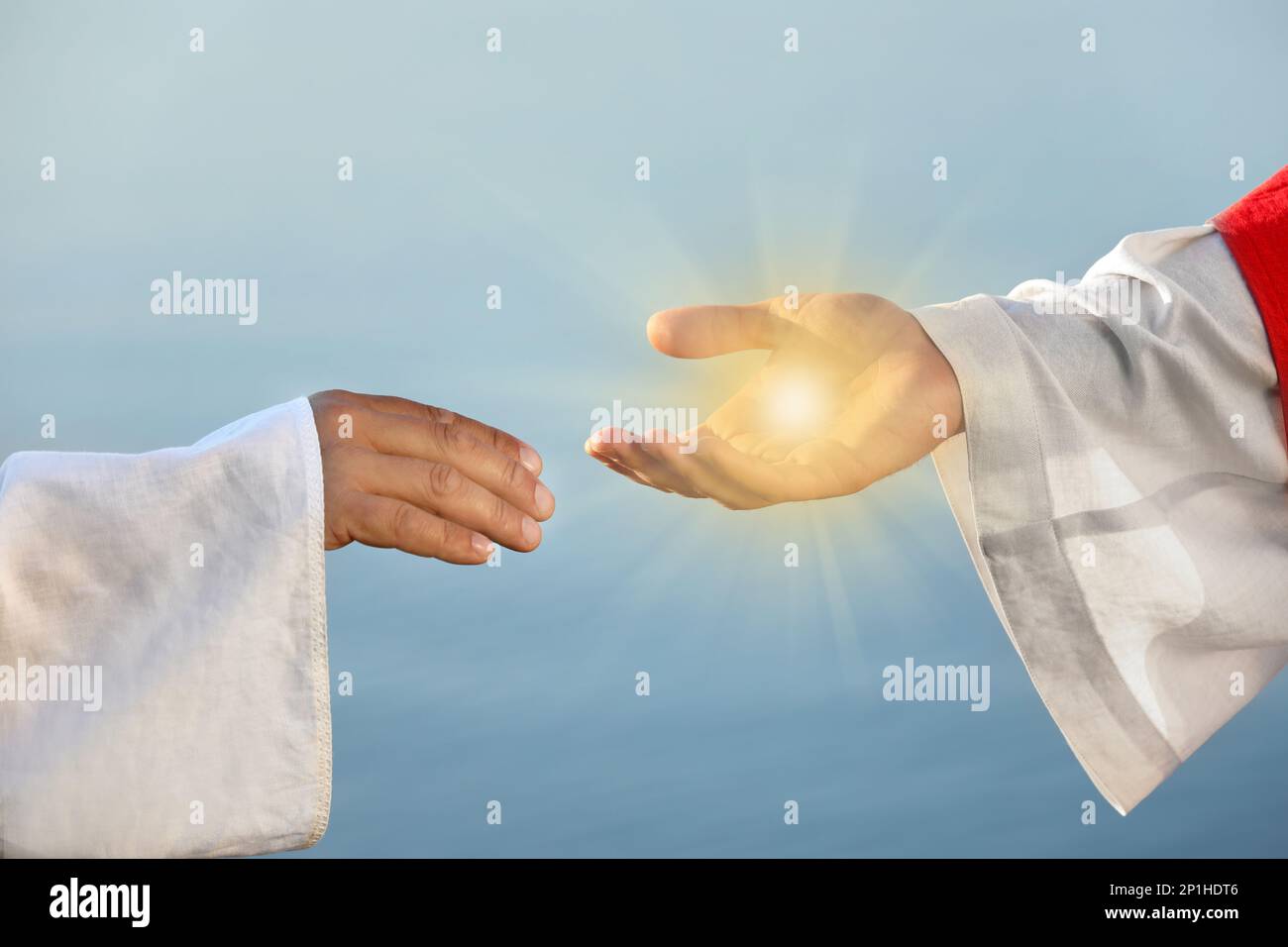 Jesus Christ and man near water outdoors, closeup. Miraculous light in ...