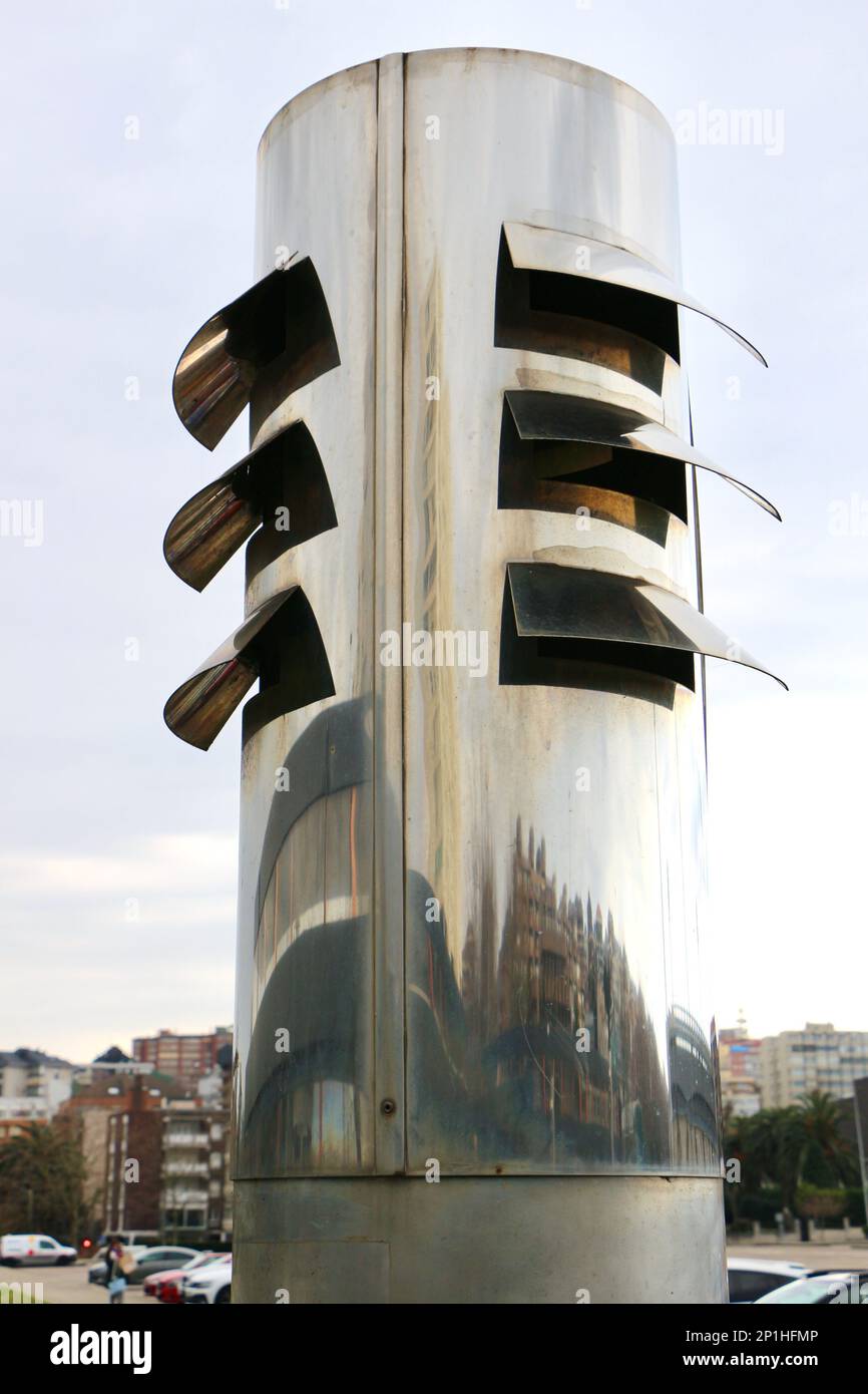 Chrome cylindrical vented chimney like objects in the car park of ...