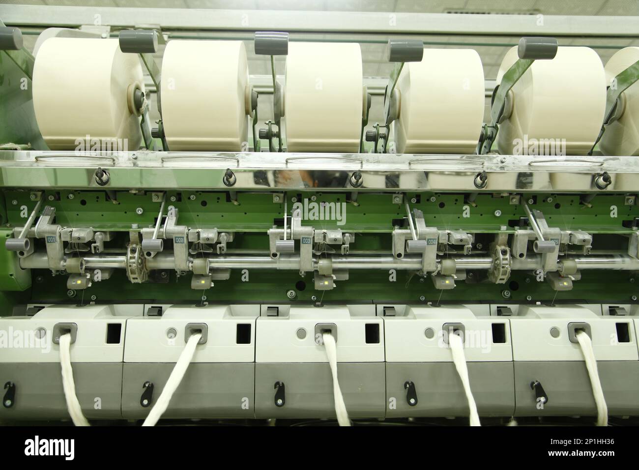 Cotton group in spinning production line factory Stock Photo - Alamy