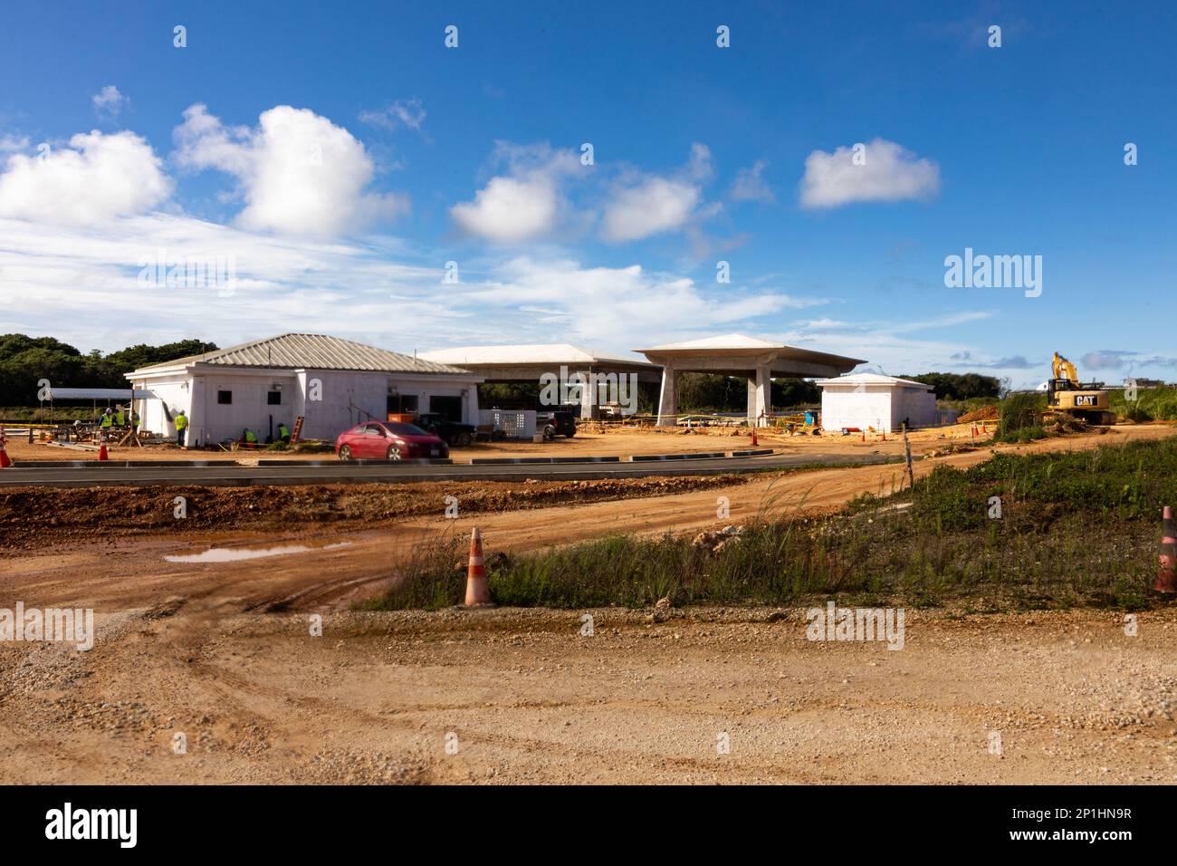 Construction workers build a vehicle search checkpoint on the main ...