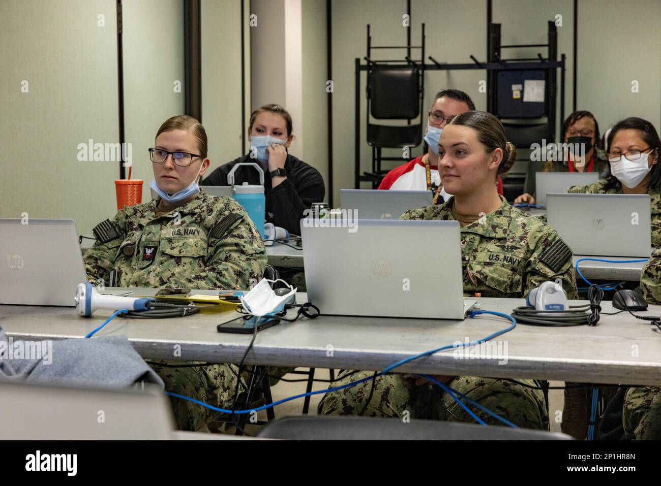 U.S. Navy Sailors and a Department of Defense civilian with Marine ...
