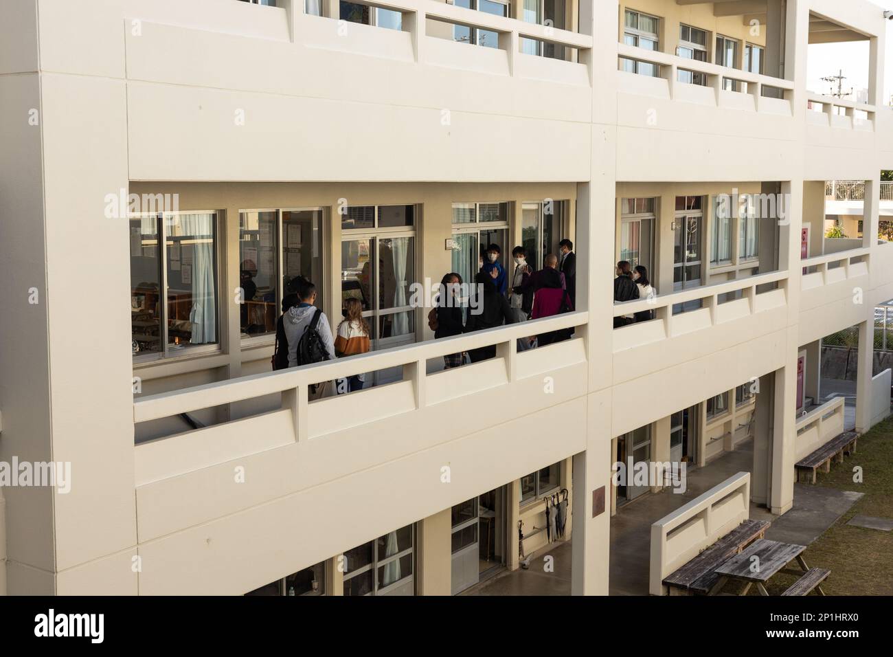 The staff of Kubasaki High School enter classrooms during a tour of the ...