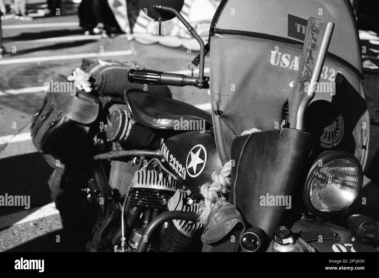 A customized motorcycle dressed for battle with a rifle in a holster ...
