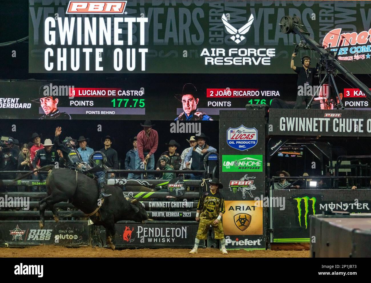 A professional bull rider competes at the PBR event “Unleash The Beast ...