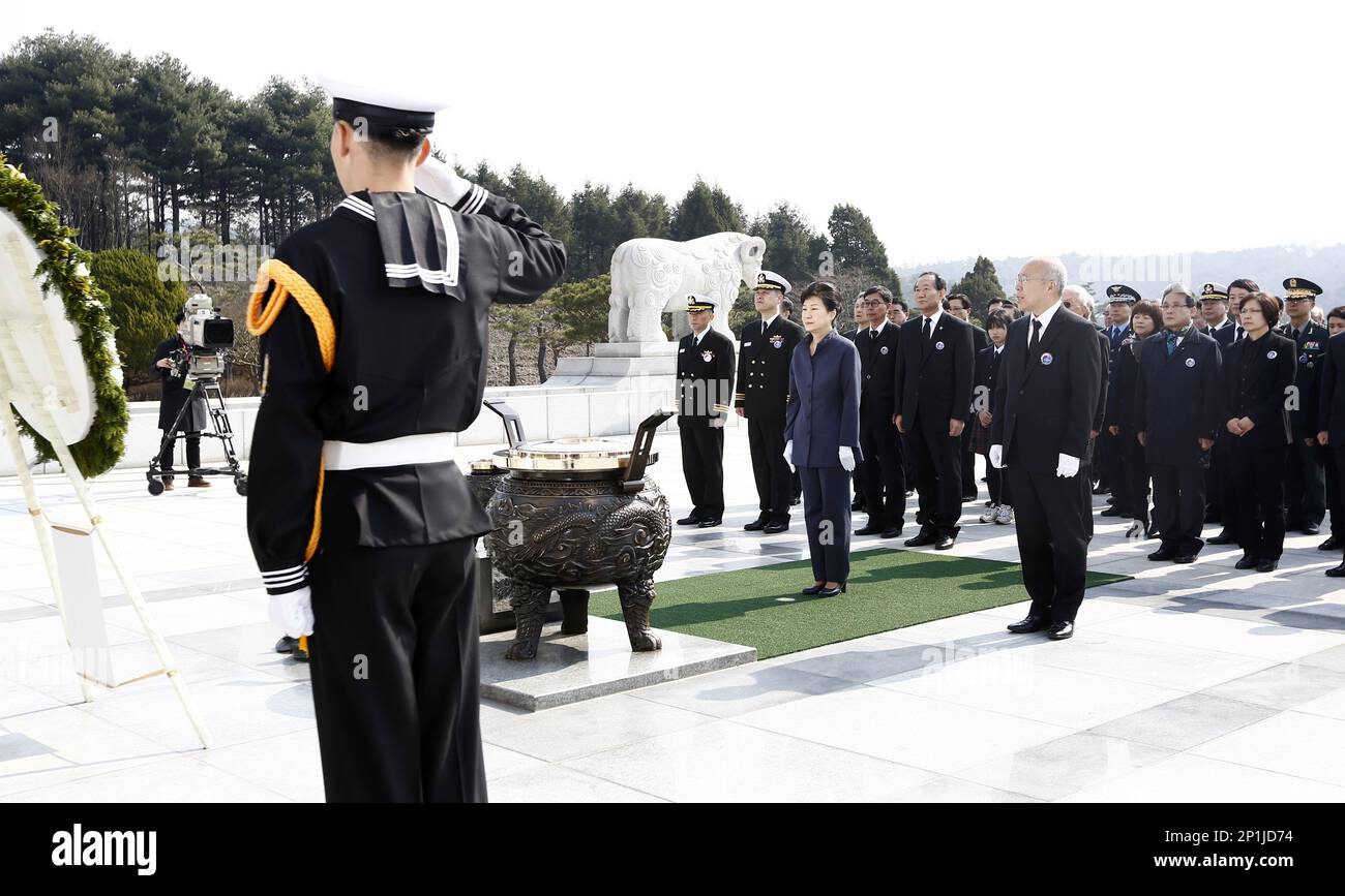South Korean President Park Geun-hye, center, pays a silent tribute ...