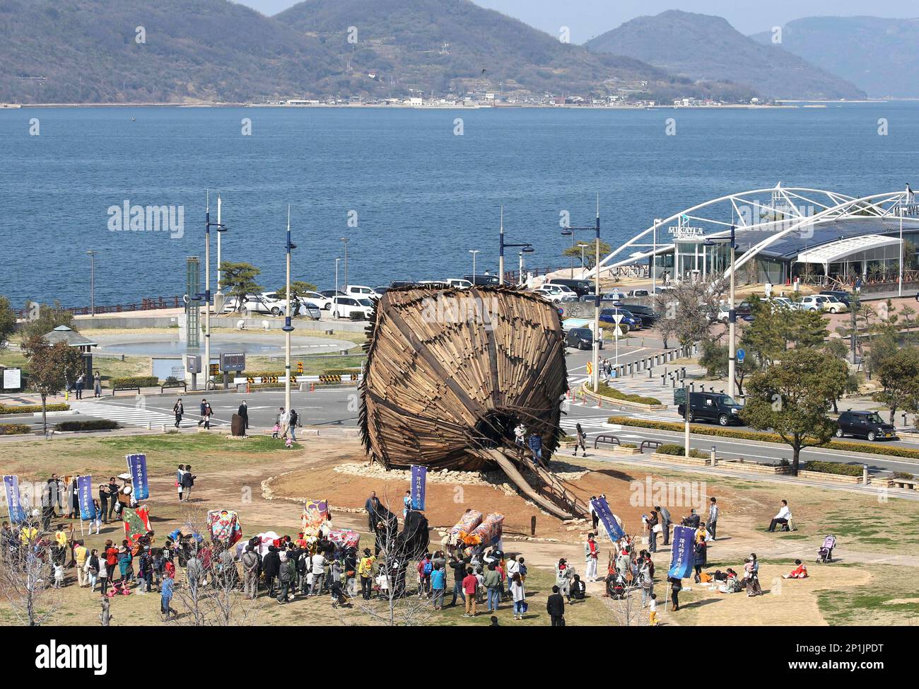 Visitors admire the artwork, "Beyond the Borders - the Ocean,'' created ...