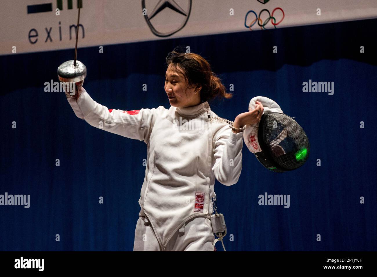 Anqi Xu of China celebrates after defeating Sarra Besbes of Tunisia in ...