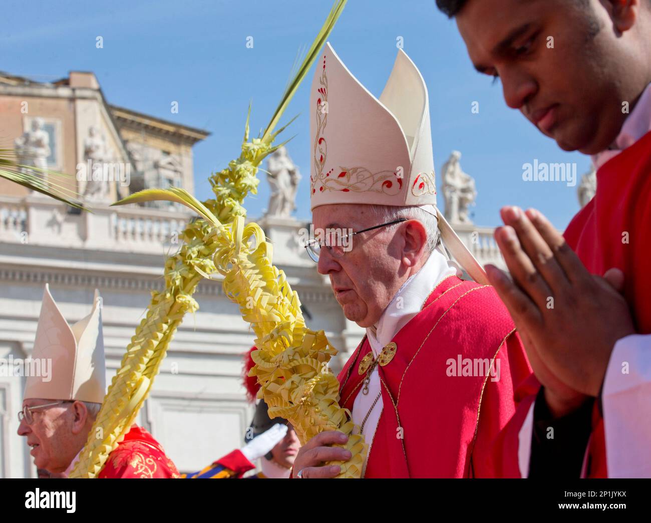 Pope Francis walks in procession as he celebrates Palm Sunday Mass, in ...