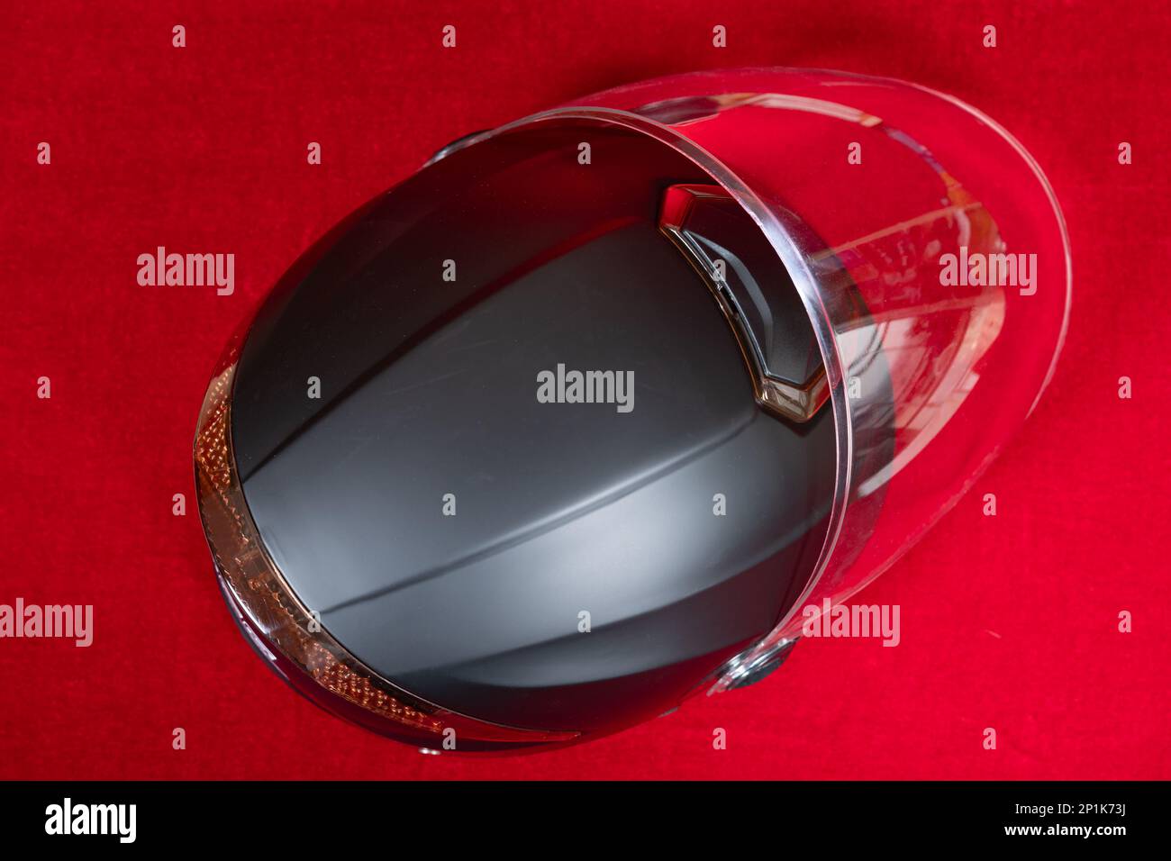 top view brand new black motobike helmet on a red background Stock ...