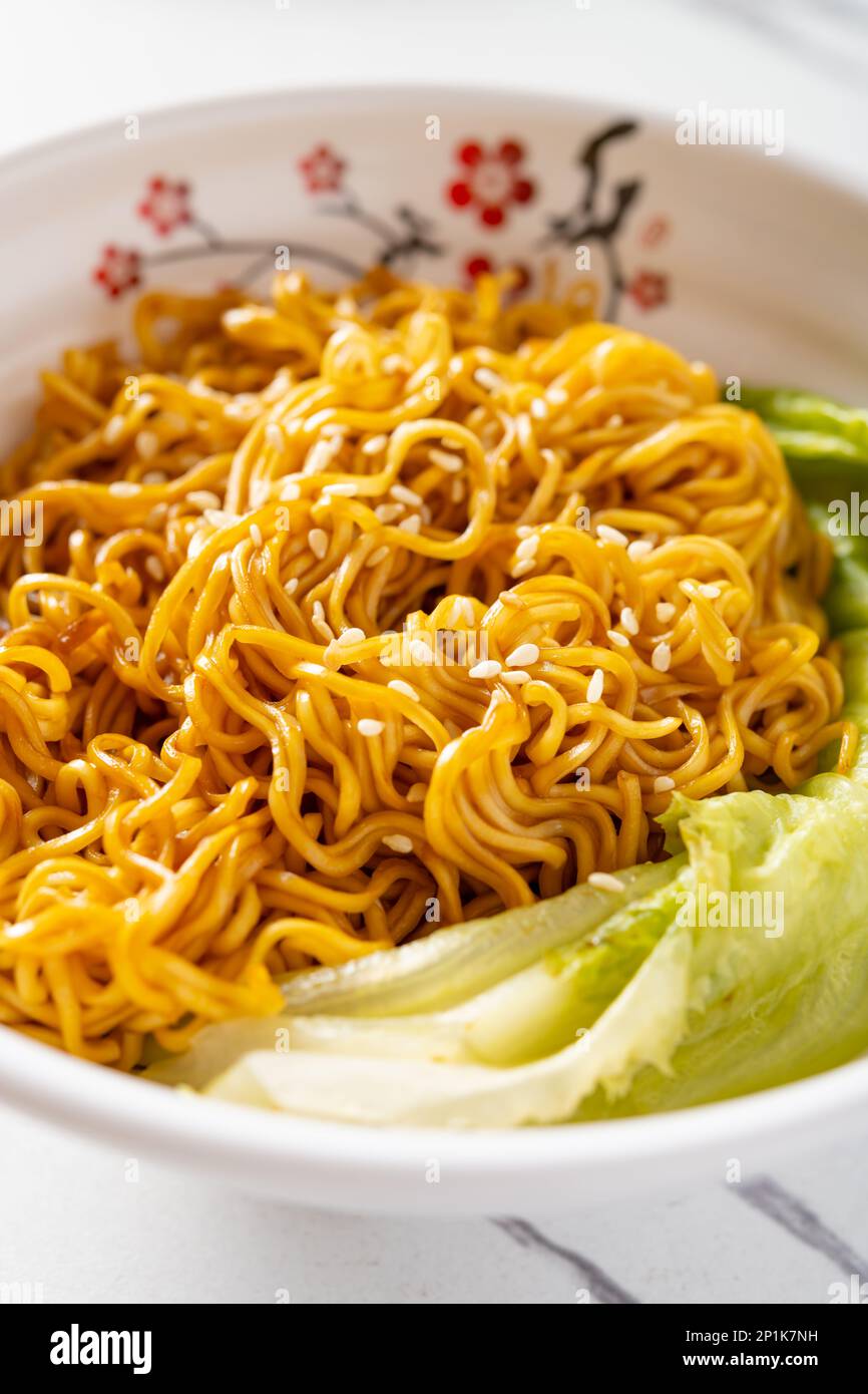 angle view bowl of noodles with cabbage vertical composition Stock ...