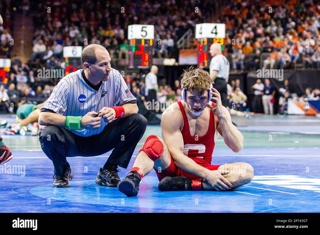 March 17, 2016: Cornell's Brian Realbuto holds his leg after pulls a ...