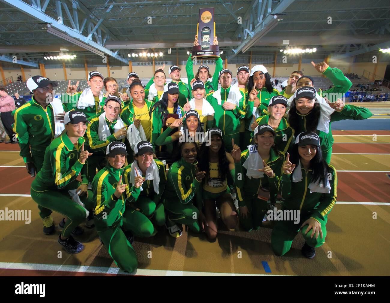 Oregon Ducks mens and womens team and coach Robert Johnson pose after ...