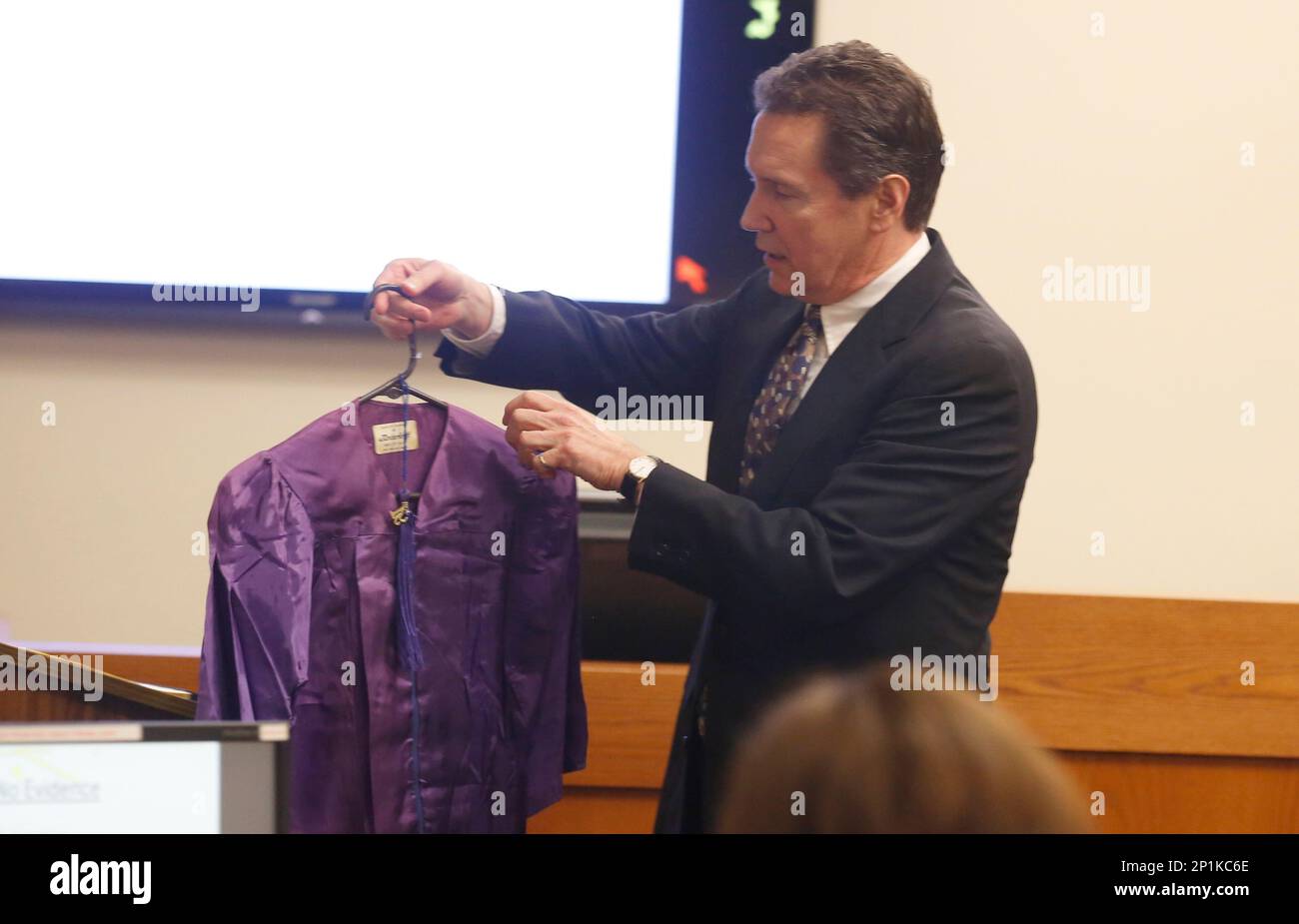 Defense attorney Gerald Krovatin, left, shows the jurors Timothy ...