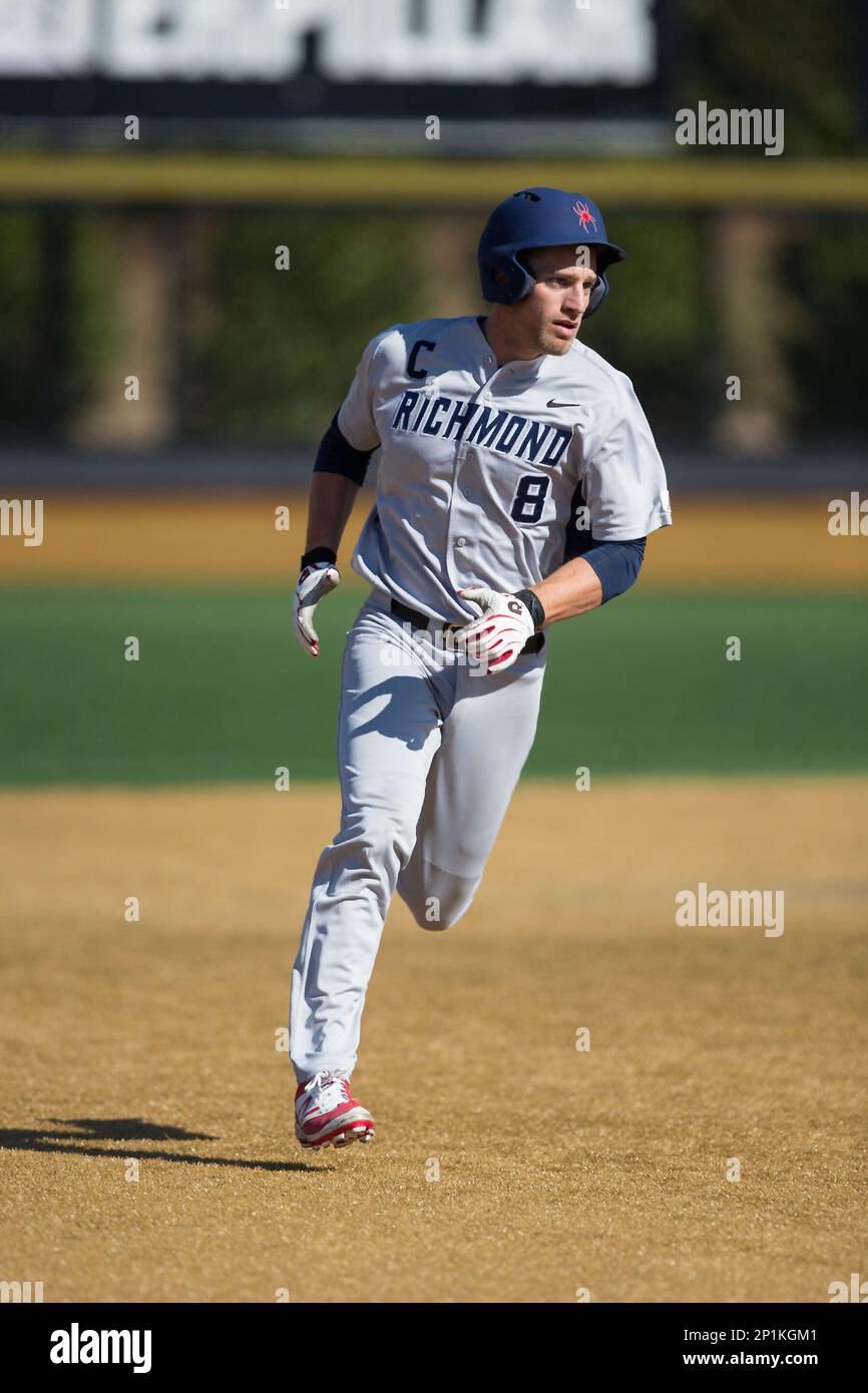 Michael Morman (8) of the Richmond Spiders hustles towards third base ...