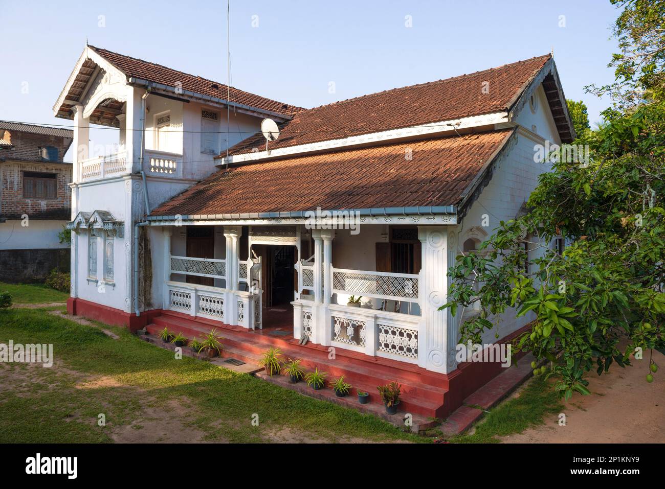 Old traditional colonial style residential house close-up in the early ...