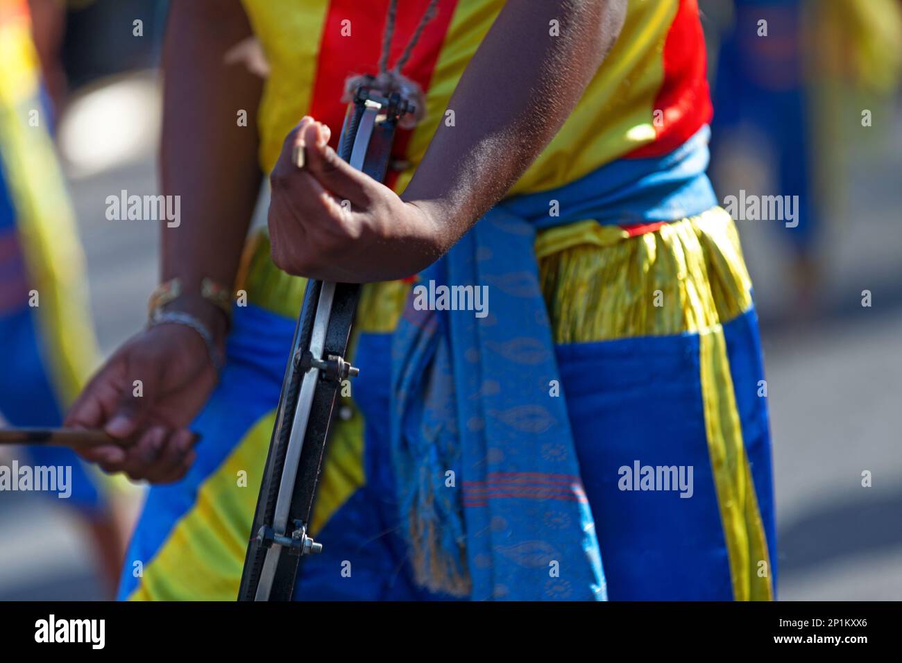 Percussionist playing with a frame drum during the carnival of the ...
