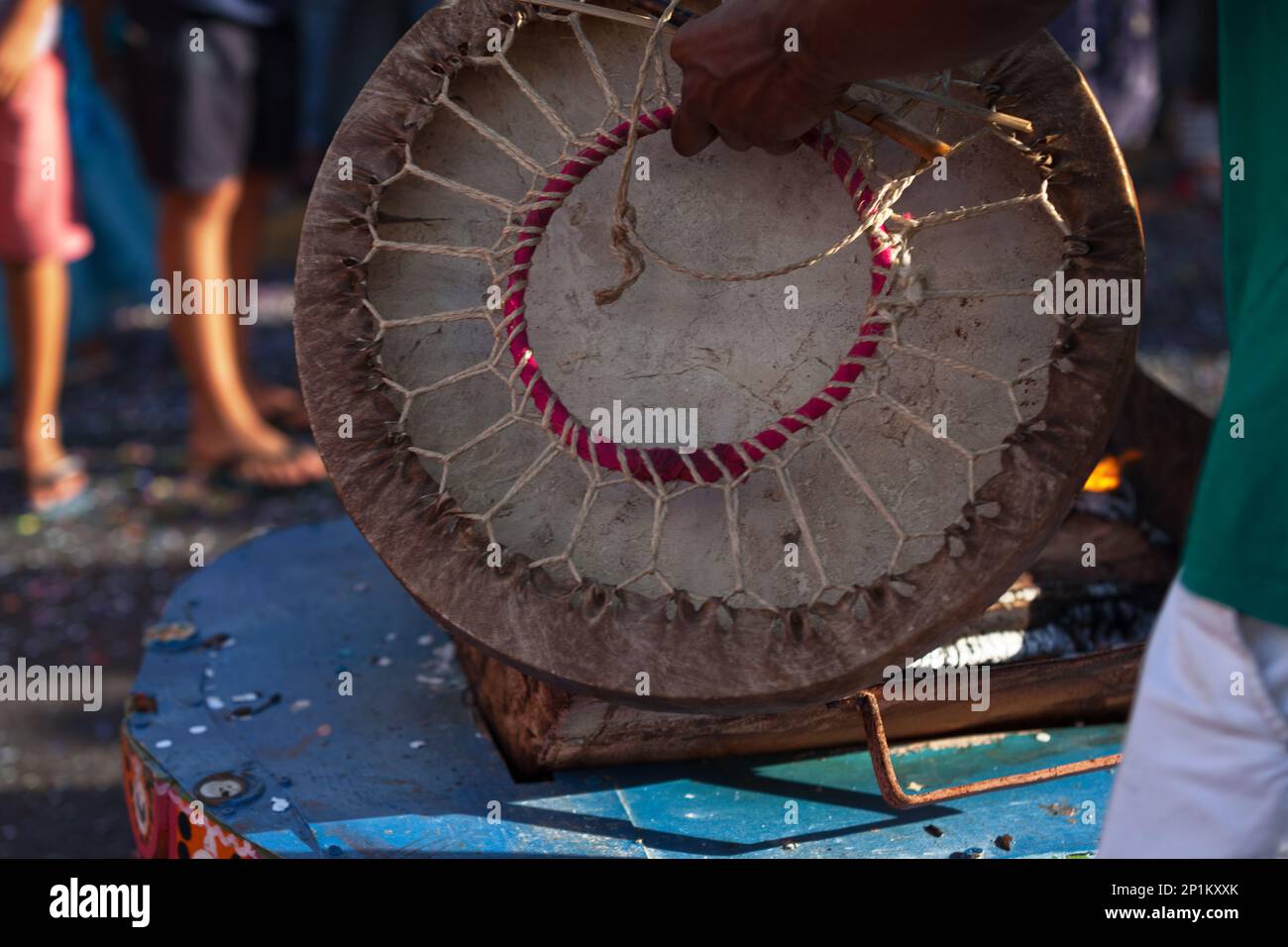 Heating of the malbar drum before playing during the carnival of the ...