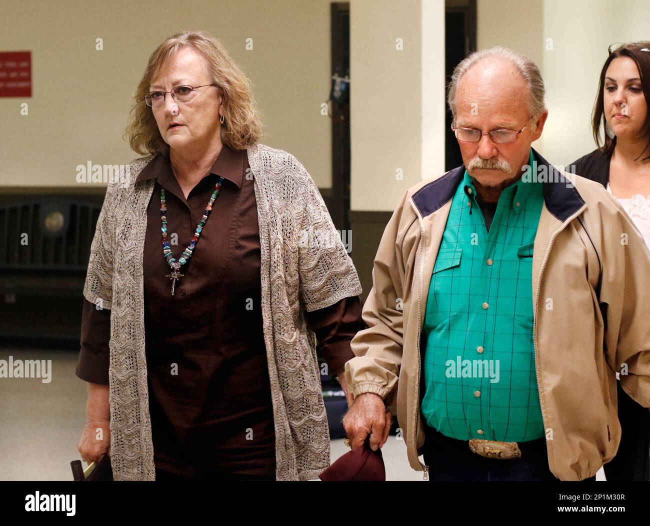 The parents of Tinker Hruby leave the courtroom after Alan Hruby was ...