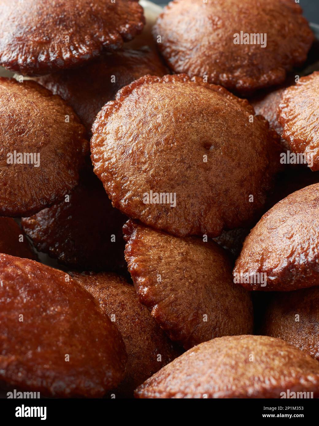 close-up view of deep fried sri lankan sweet called kevum or kavum ...